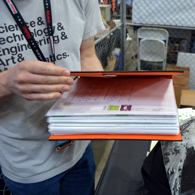 Eric-with-schematic-binder | Hackaday