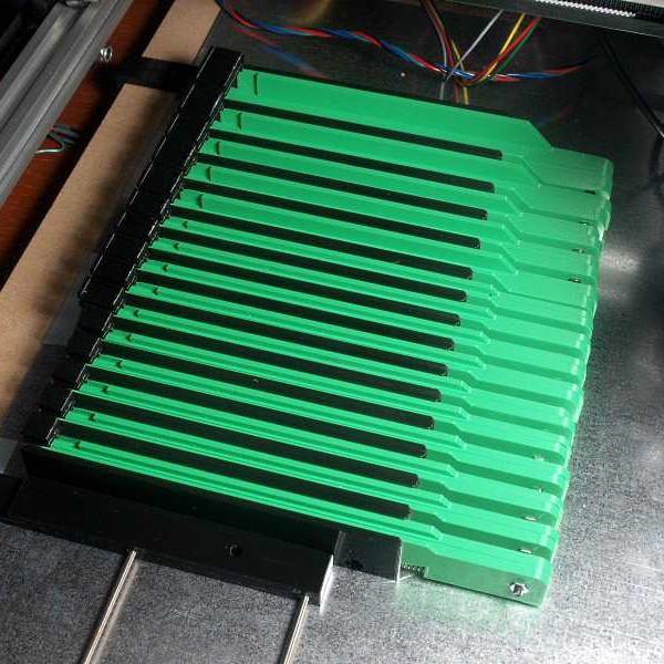 Make A Better, Spring-Loaded SMT Tape Strip Holder | Hackaday