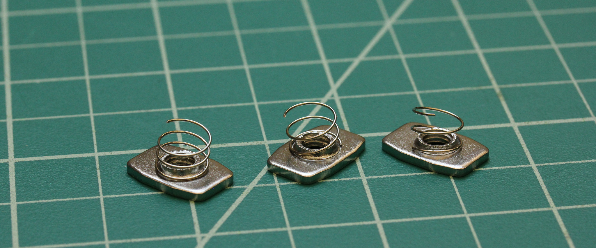 How To Make Your Own Springs For Extruded Rail T-Nuts | Hackaday