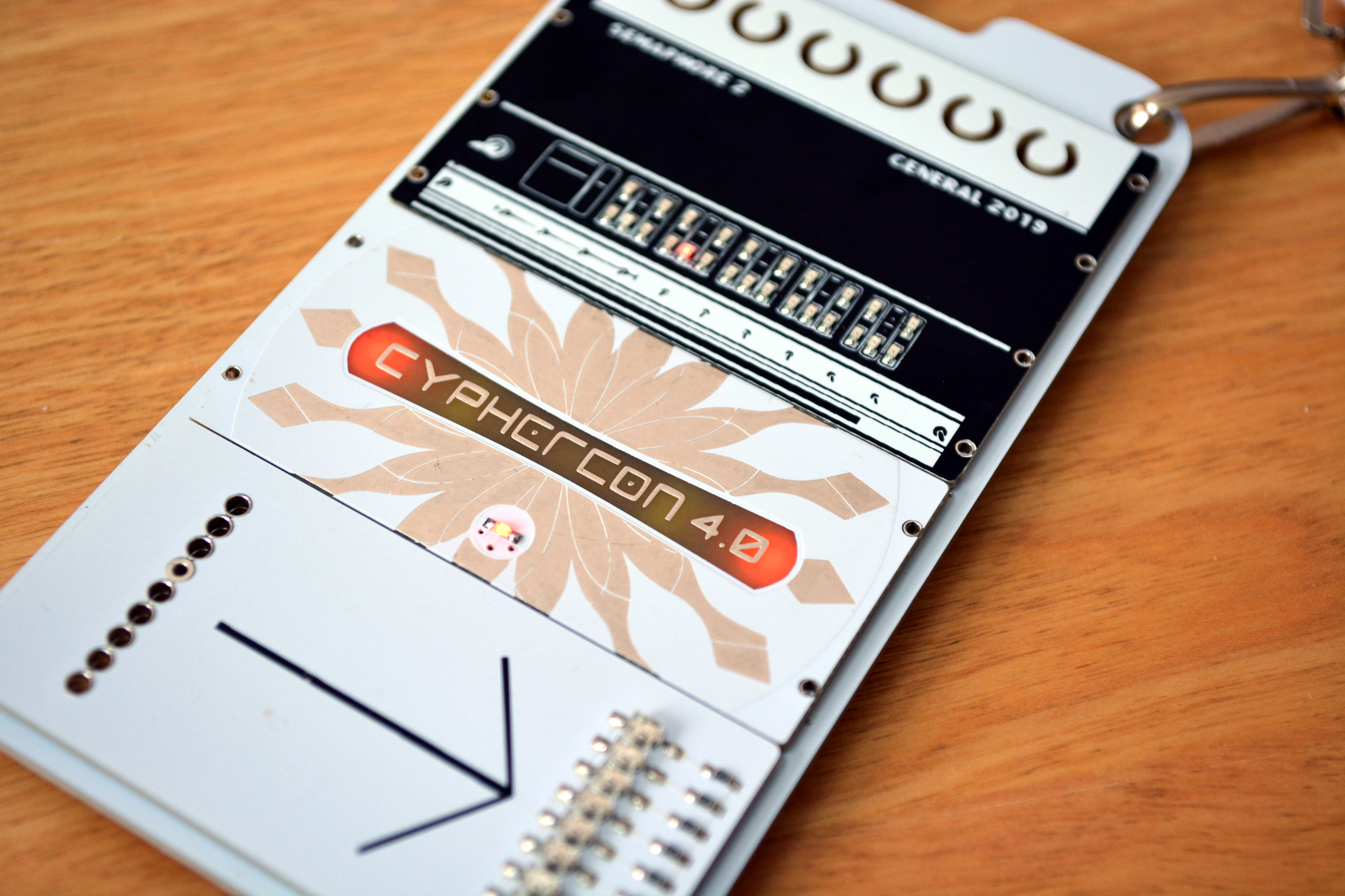 Cyphercon Badge Has A Paper Tape Reader Built In | Hackaday