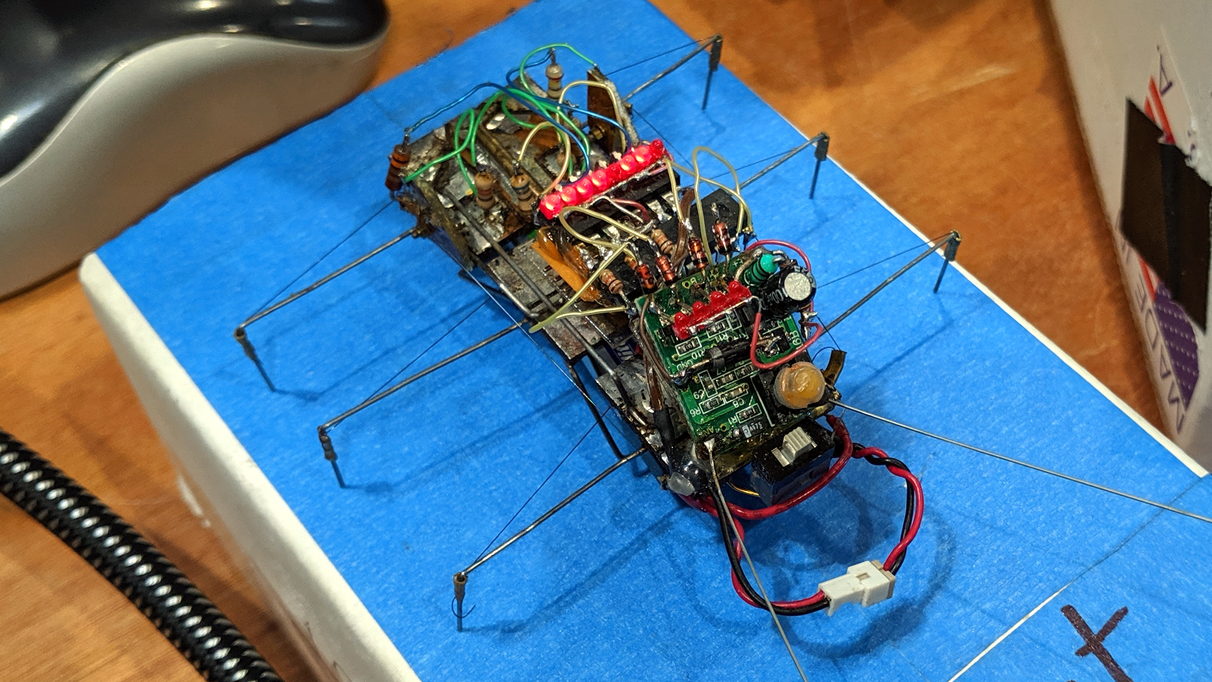 Muscle Wire BugBot And A Raspberry Pi Android With Its Eye On You At Maker Faire | Hackaday
