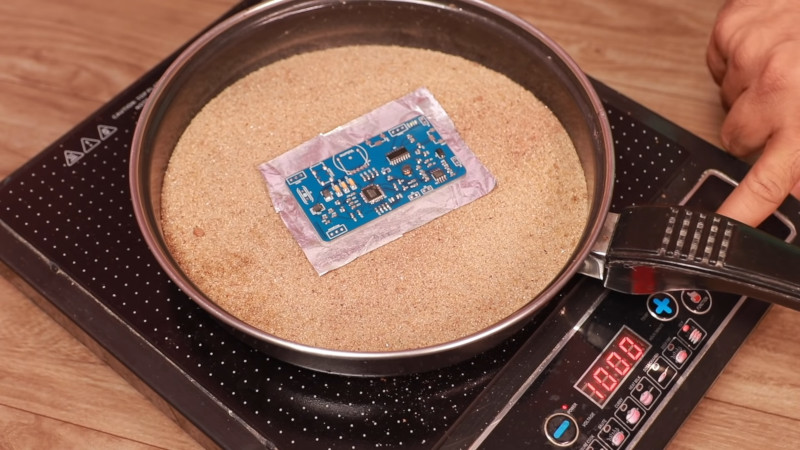 Solder SMDs With A Pan O’ Sand | Hackaday